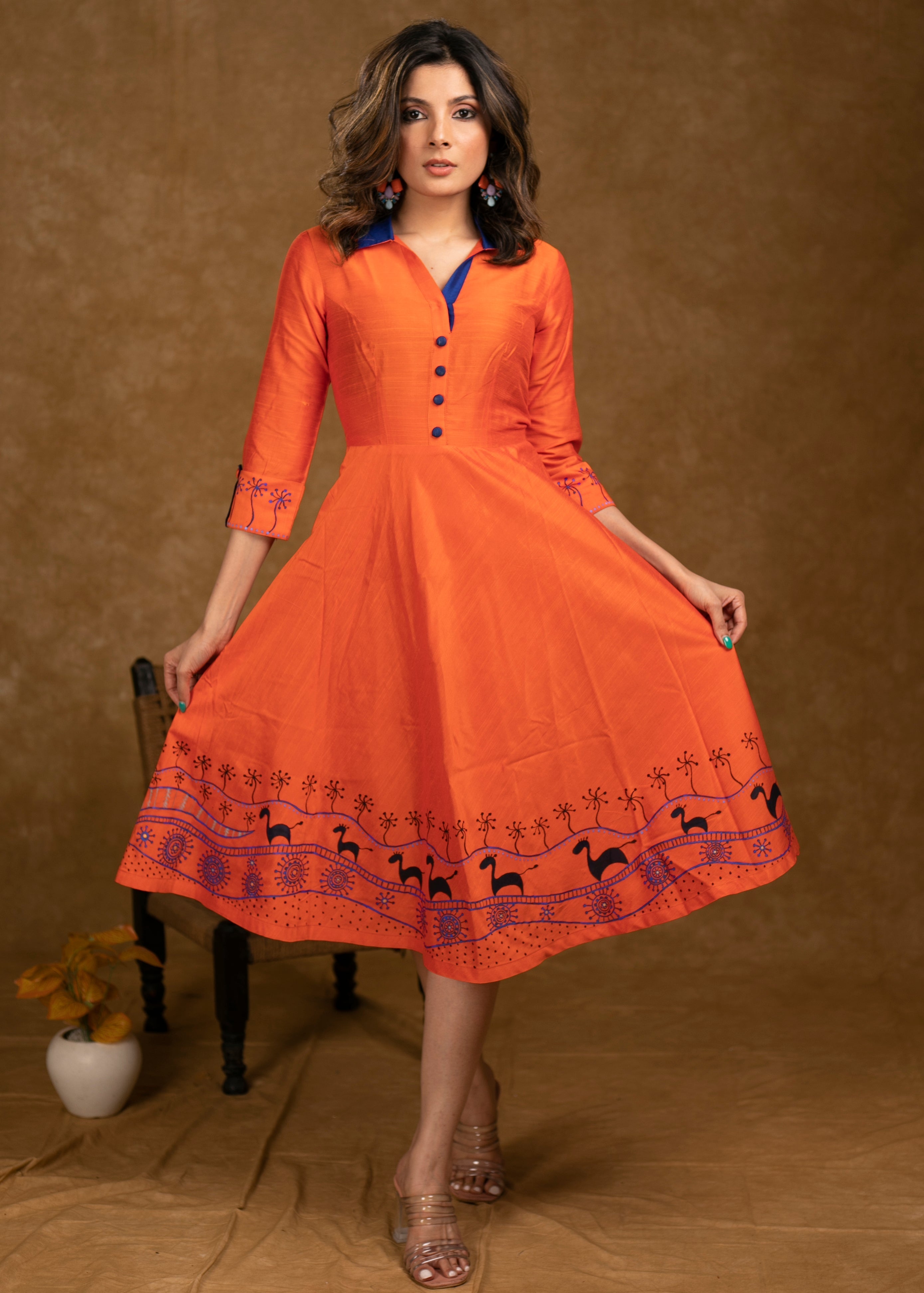 Exclusive Orange Cotton Silk Dress with Gond Painting on Hemline and S ...